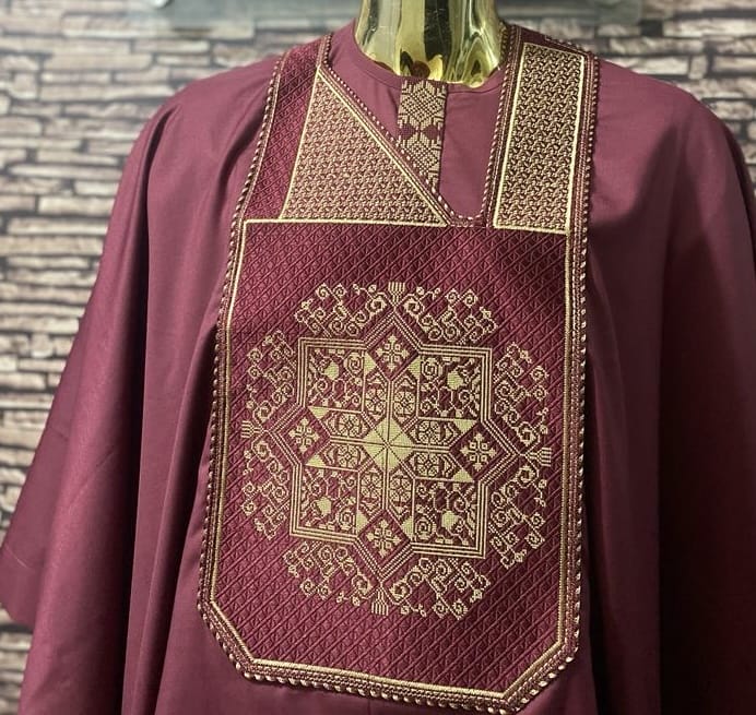 Burgundy agbada with beautiful gold embroidery on the front, featuring ...